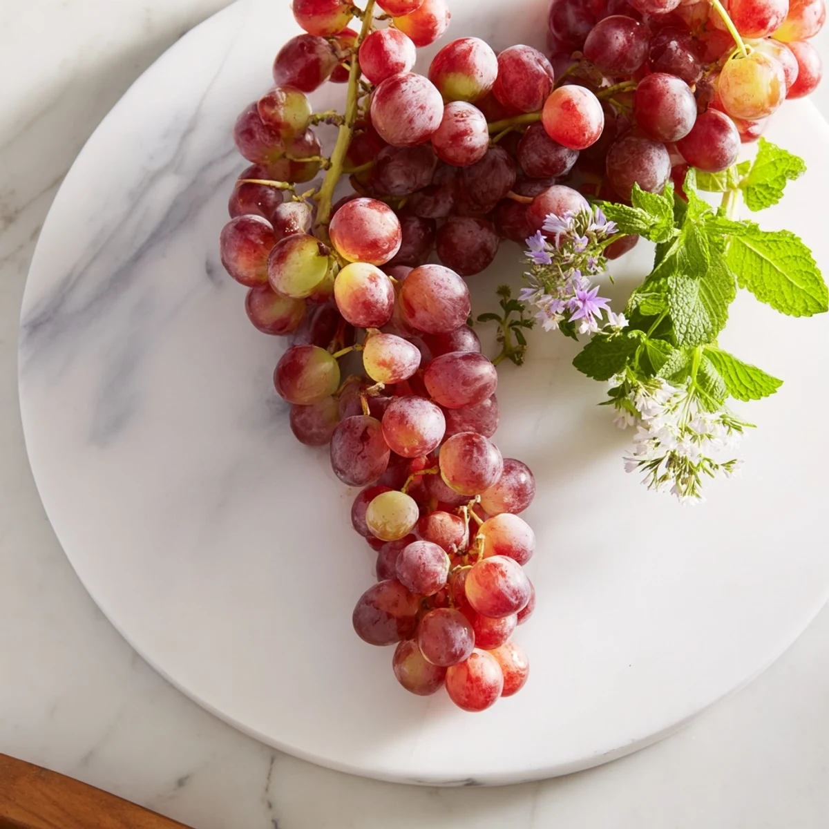Juicy Grapes Cascading Over Serving Board